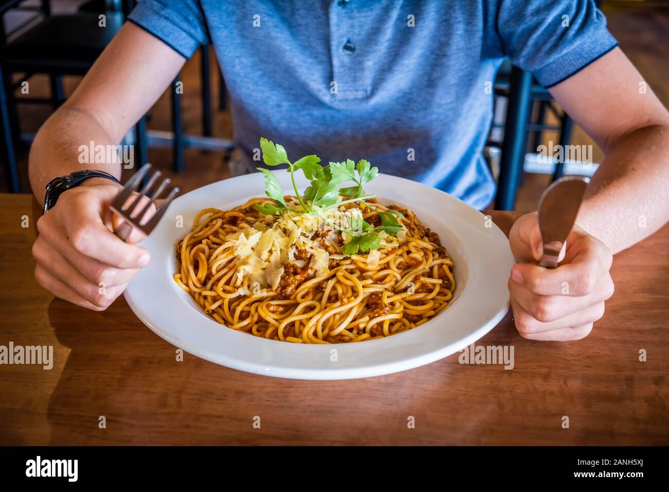 Man holding knife and fork hi-res stock photography and images - Alamy