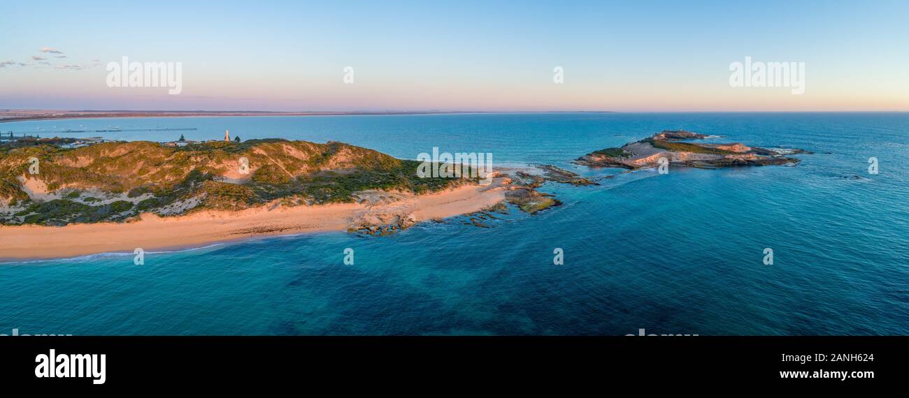Cape Martin Lighthouse and Penguin Island at dusk - aerial panorama ...
