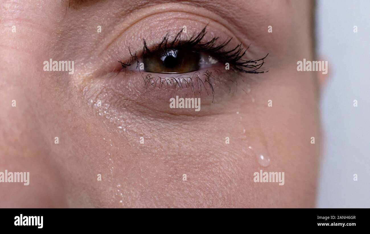 Woman crying suffering seasonal allergies, lacrimation, bad cosmetics ...