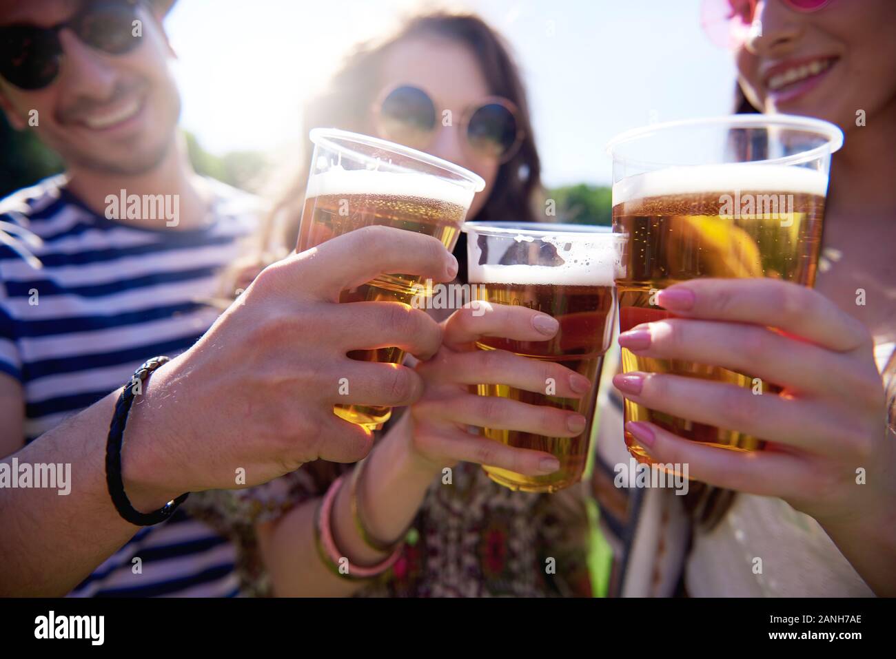 Friends making a cheers outdoors Stock Photo - Alamy