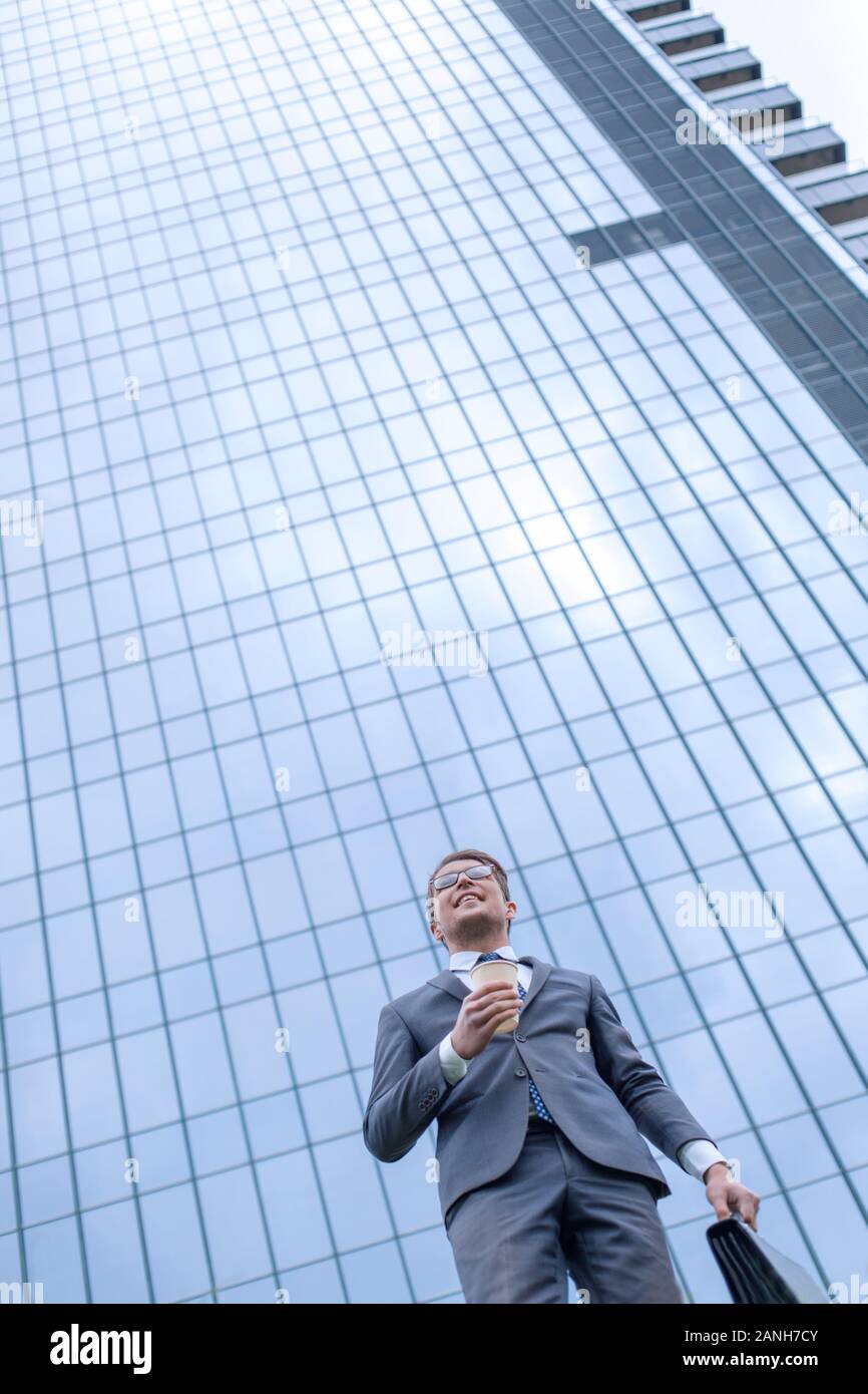 modern business man standing near a tall office building Stock Photo ...