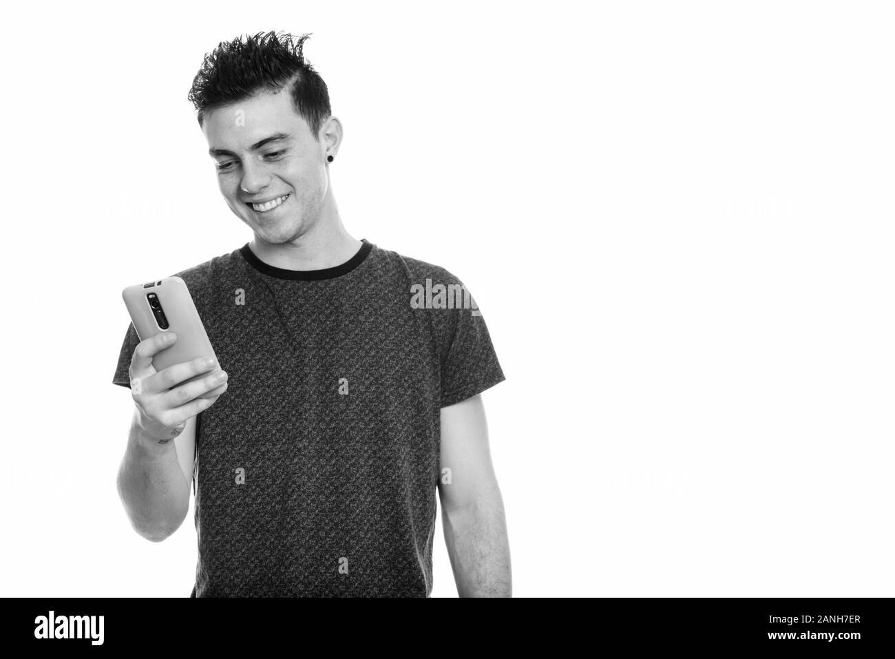 Handsome smiling man using Black and White Stock Photos & Images - Alamy
