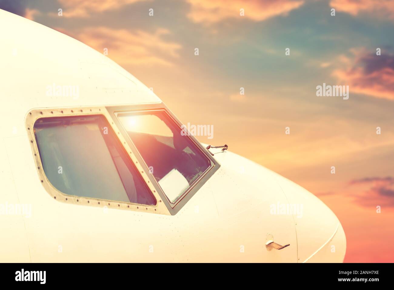 Close-up modern passenger commercial airplane cockpit flying against ...