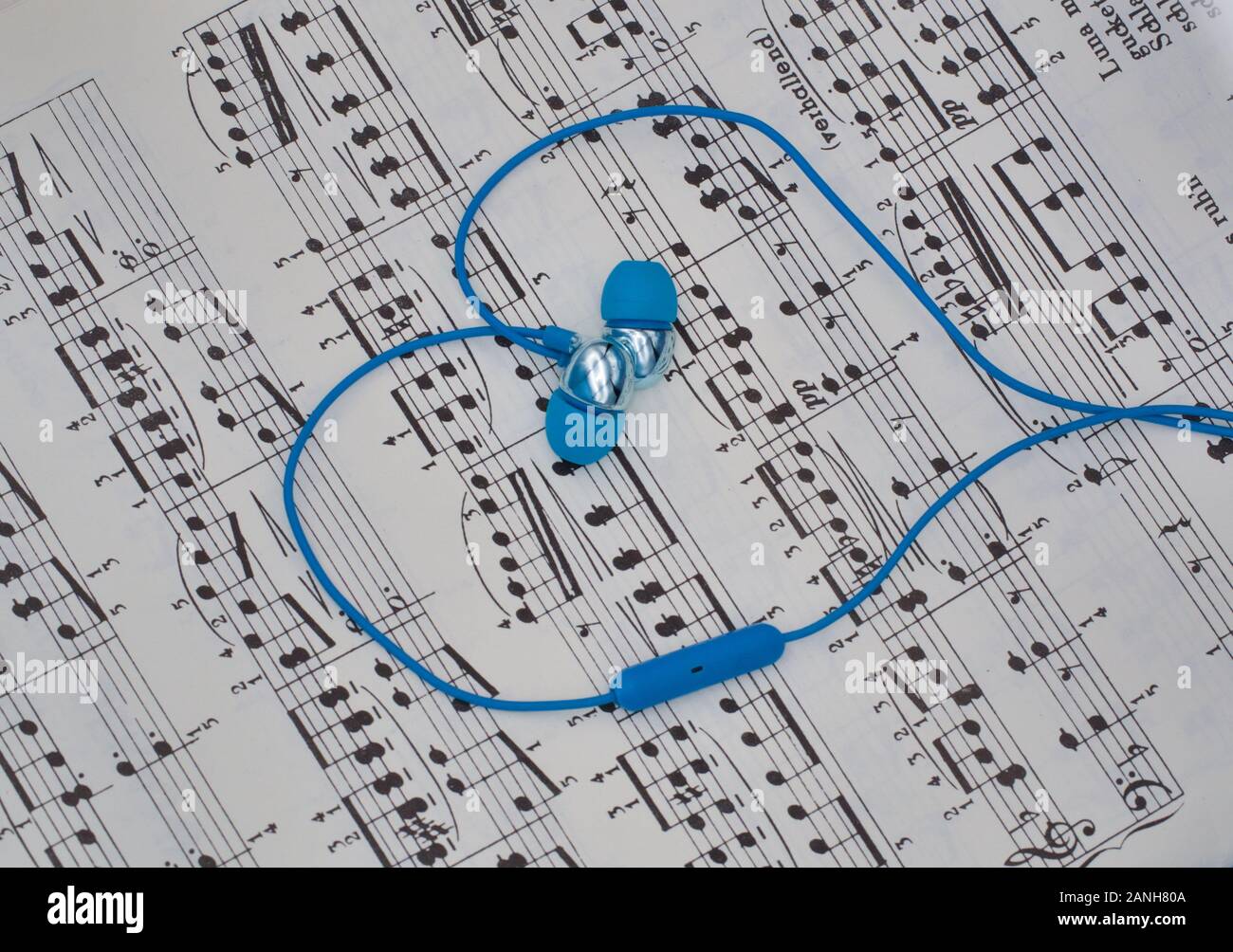 musical notation with earphones forming a heart Stock Photo - Alamy