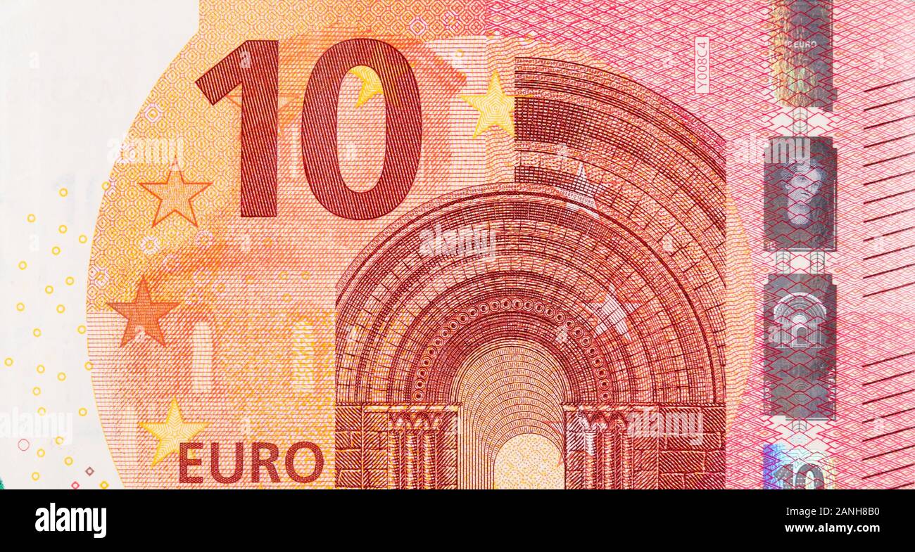 Fragment part of 10 euro banknote close-up with small red details ...