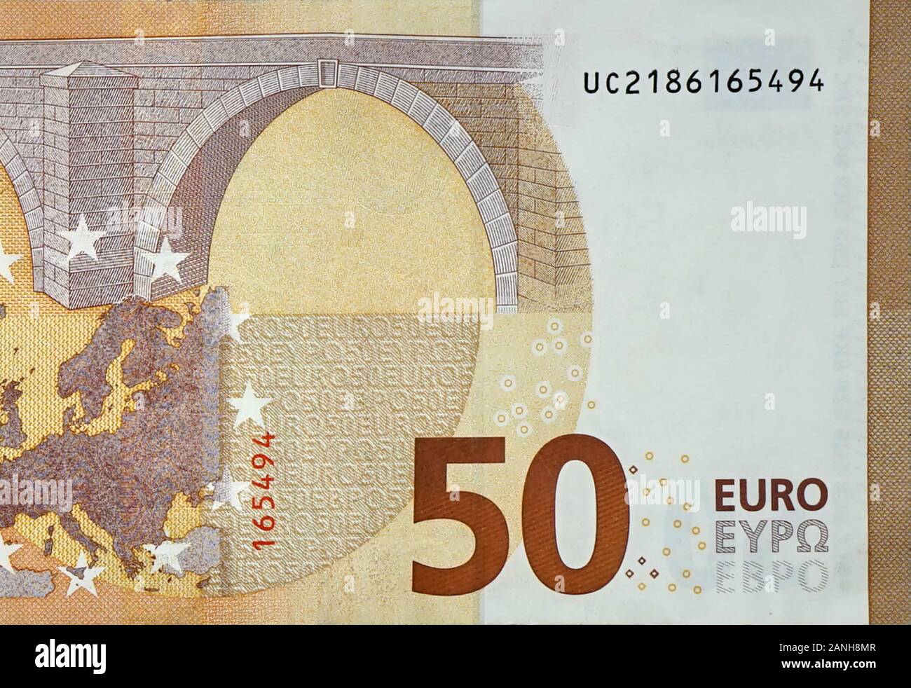 Fragment part of 50 euro banknote close-up with small brown details ...