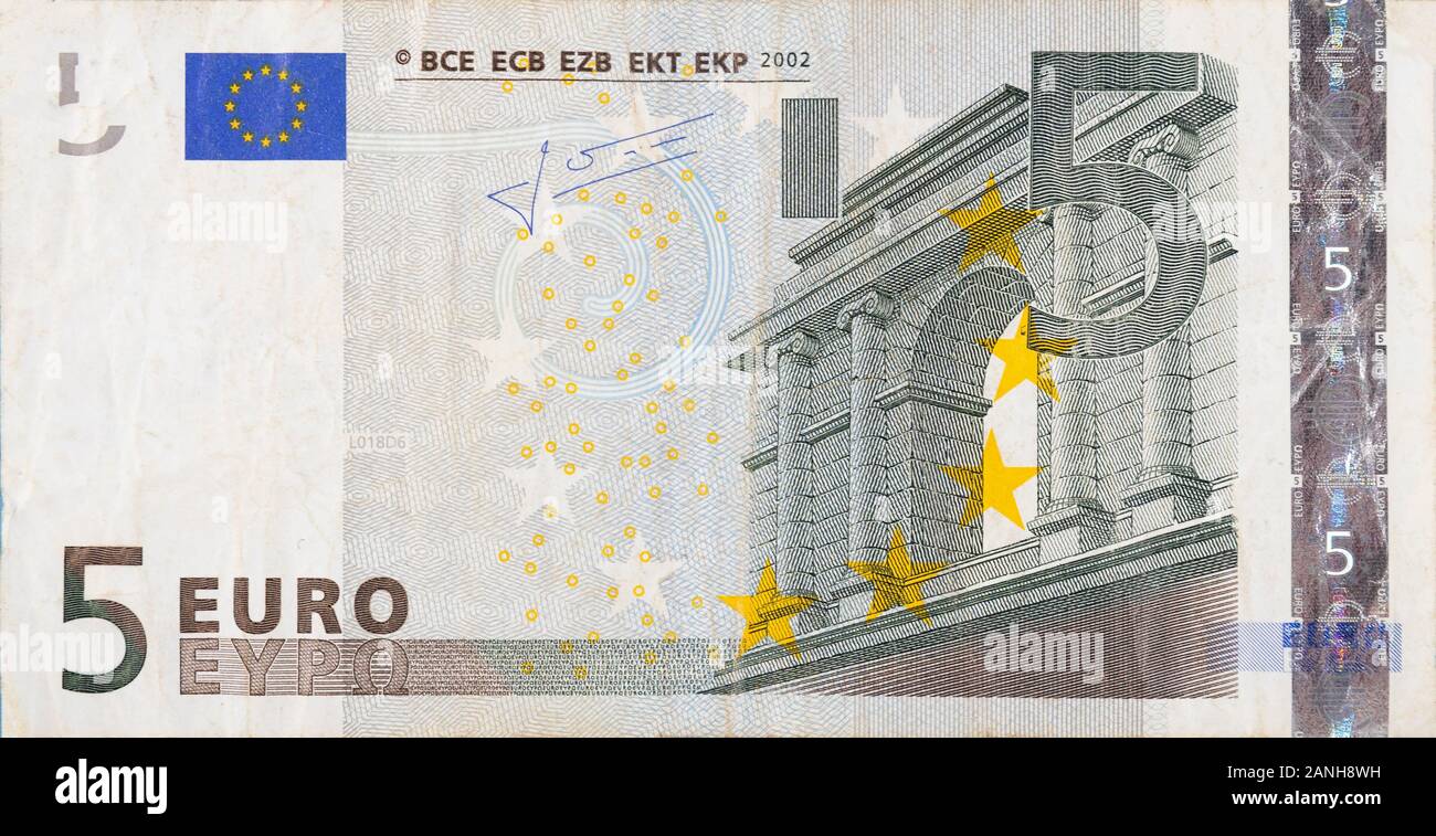 Fragment part of 5 euro banknote close-up with small brown details ...