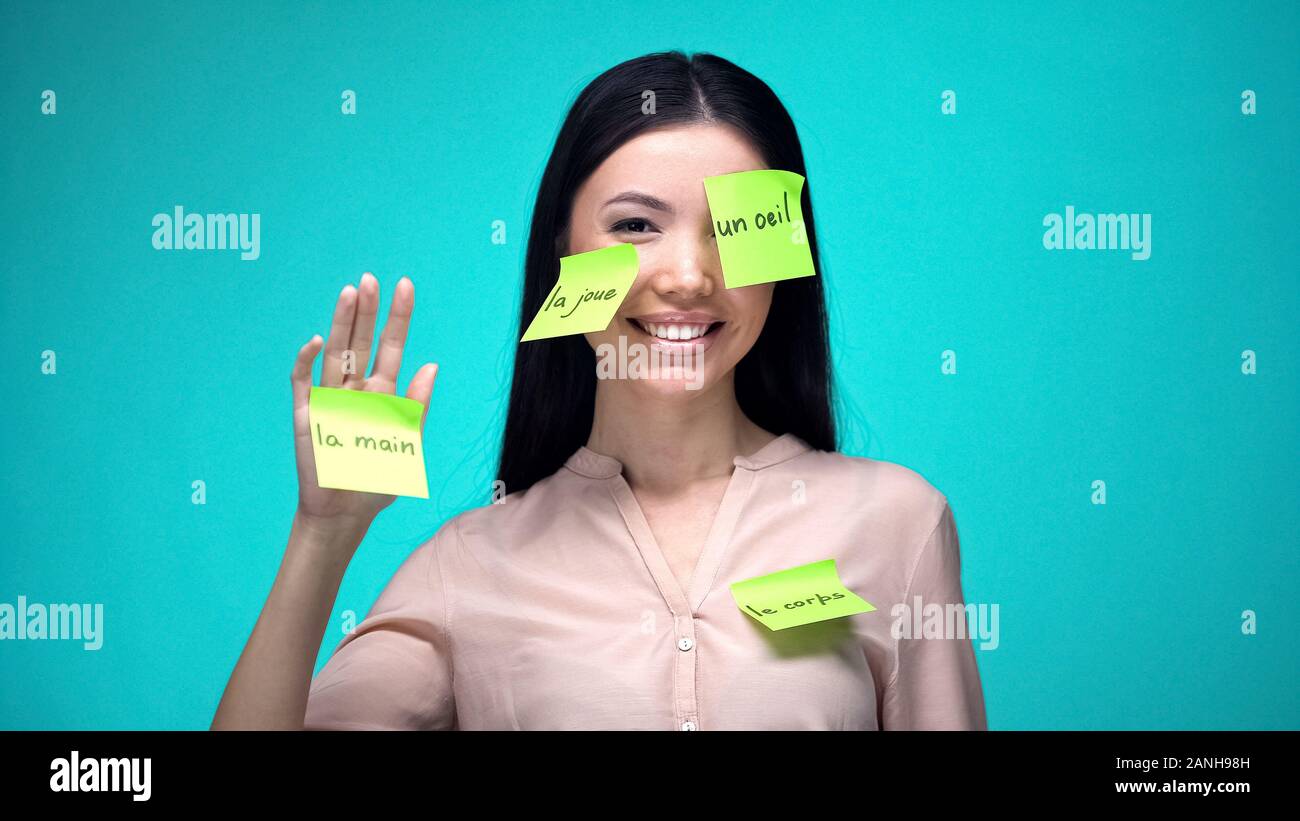 Student learning language, covered with French eye cheek hand body ...