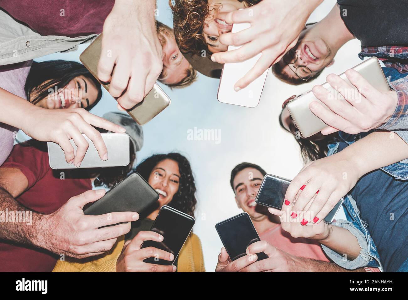 Group of friends using mobile smartphones outdoor - Millennial young ...