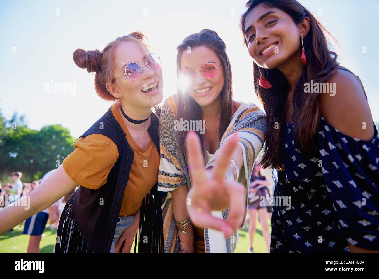 Peace sign and three friends Stock Photo - Alamy