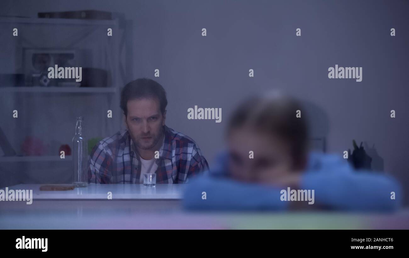 Father alcoholic looking at daughter on sill, family tragedy, bad ...