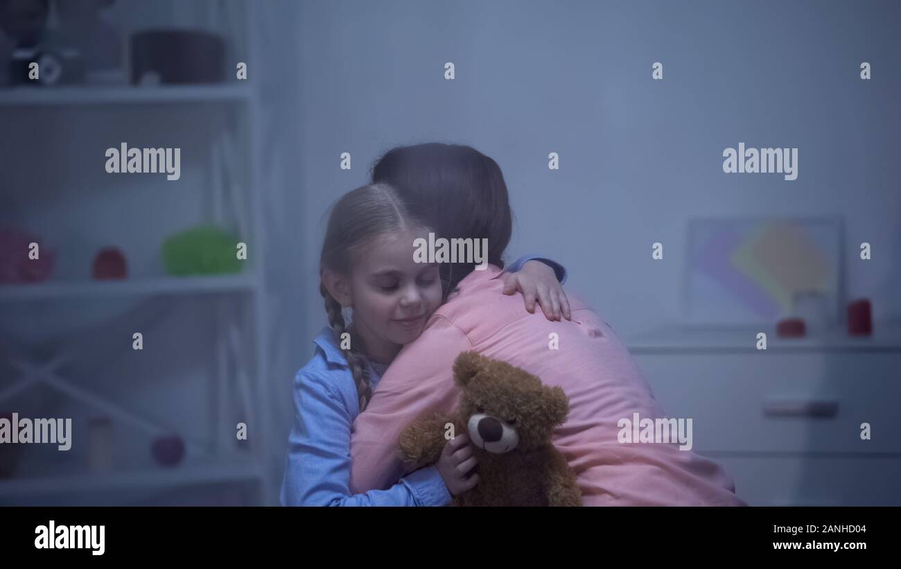 Mother daughter hug with teddybear hi-res stock photography and images ...