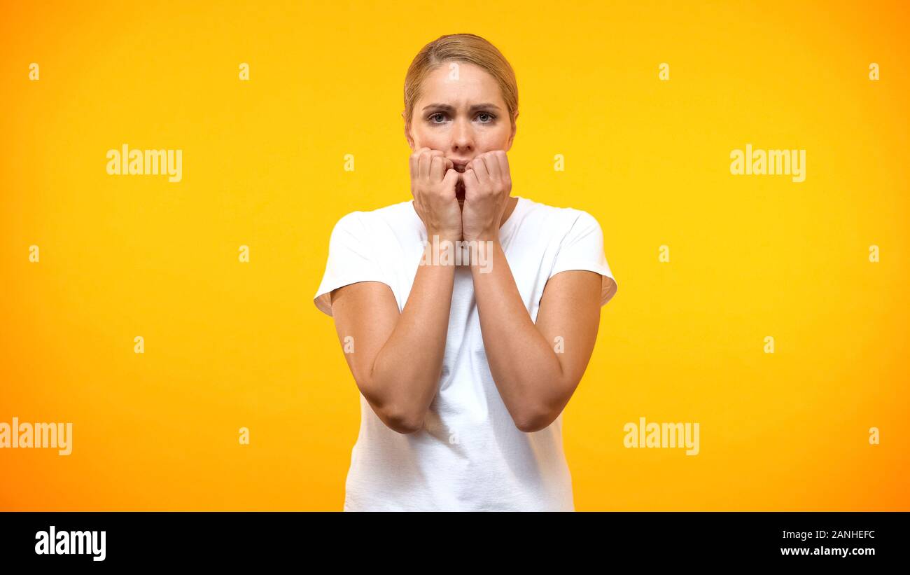 Worried woman looking camera, panic attack, fear expression, stress ...