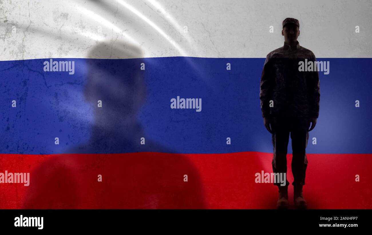 Russian soldier silhouette standing against national flag, proud army ...