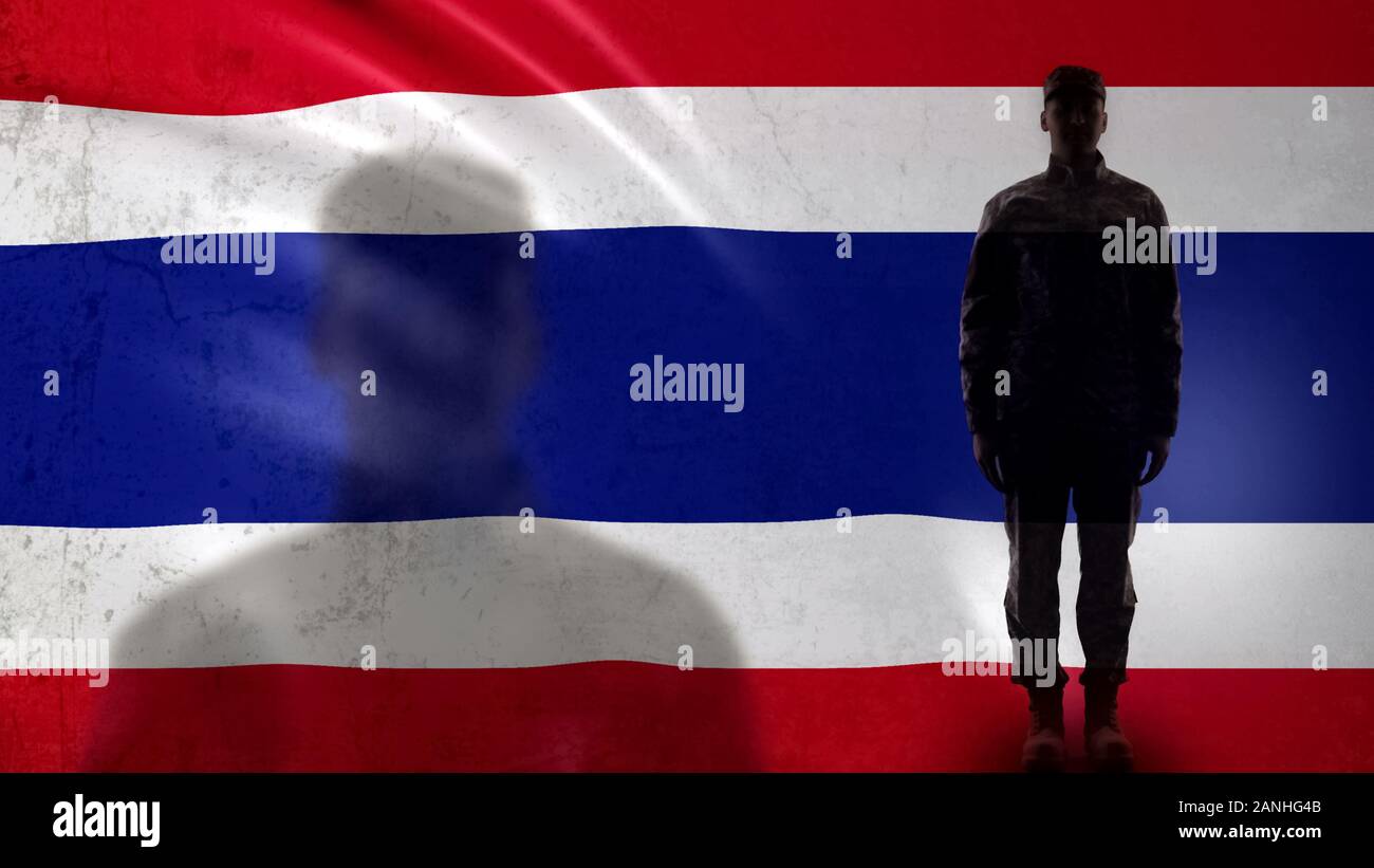Thai soldier silhouette standing against national flag, proud army ...
