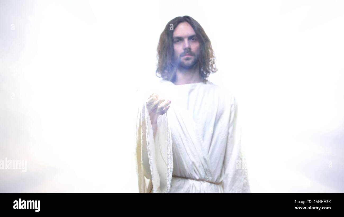 God in white robe giving light to people, concept of religious miracle ...
