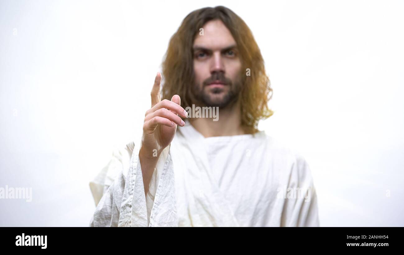 Jesus raising finger, warning against sin, teaching Christians ...