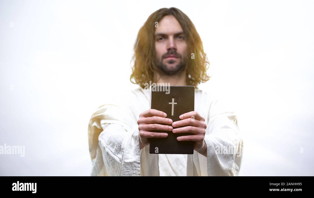 Jesus giving Holy Bible, calling for prayer, righteous living in ...