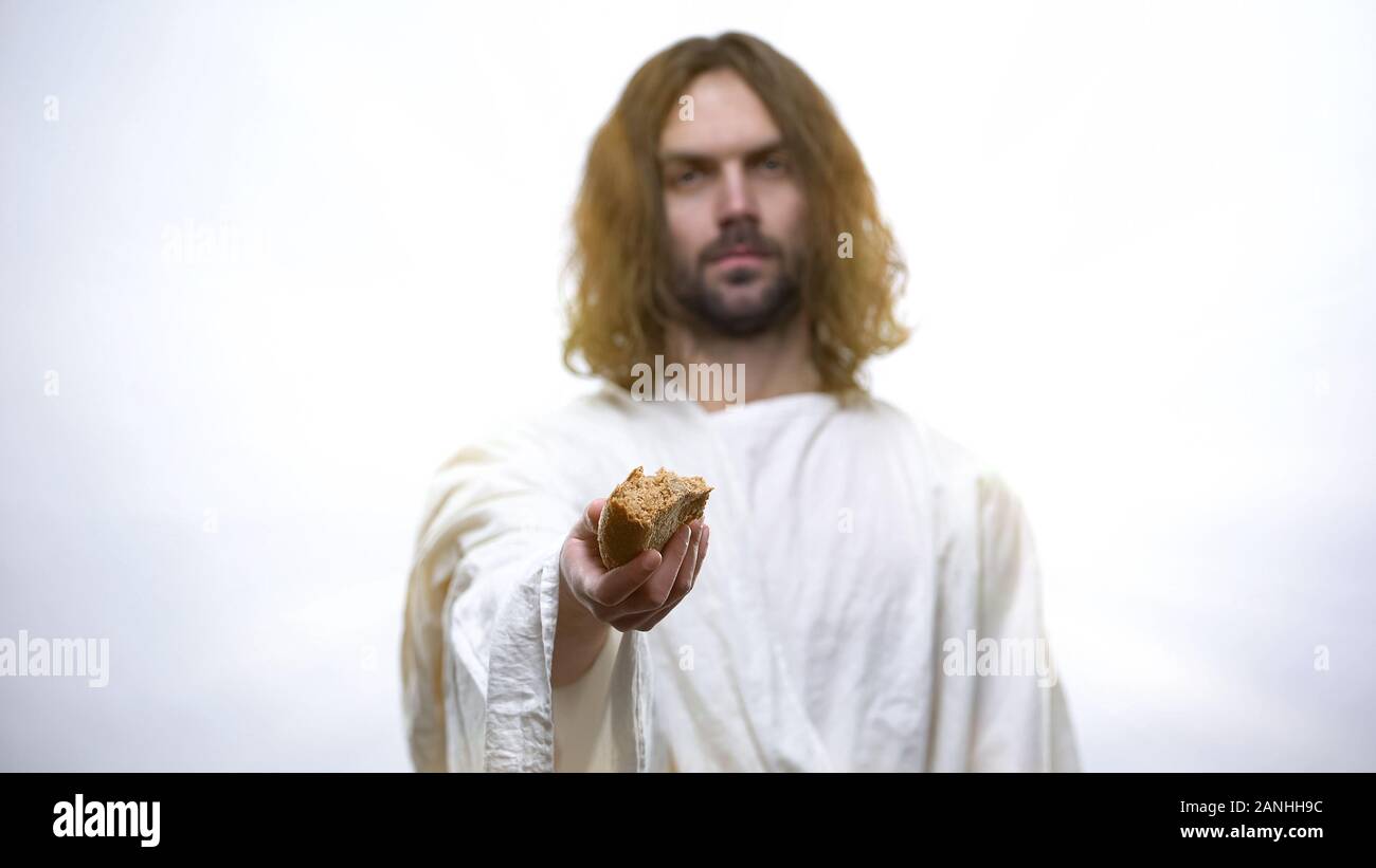 Good Jesus holding out bread, religious concept to give food to hungry ...