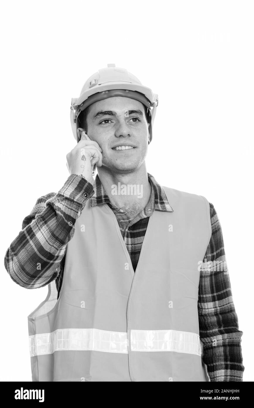 Happy young man construction worker talking on the phone Stock Photo ...