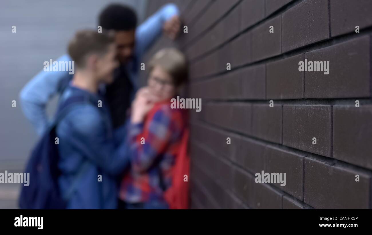 Students bullying classmate in school backyard, children rights blurred ...