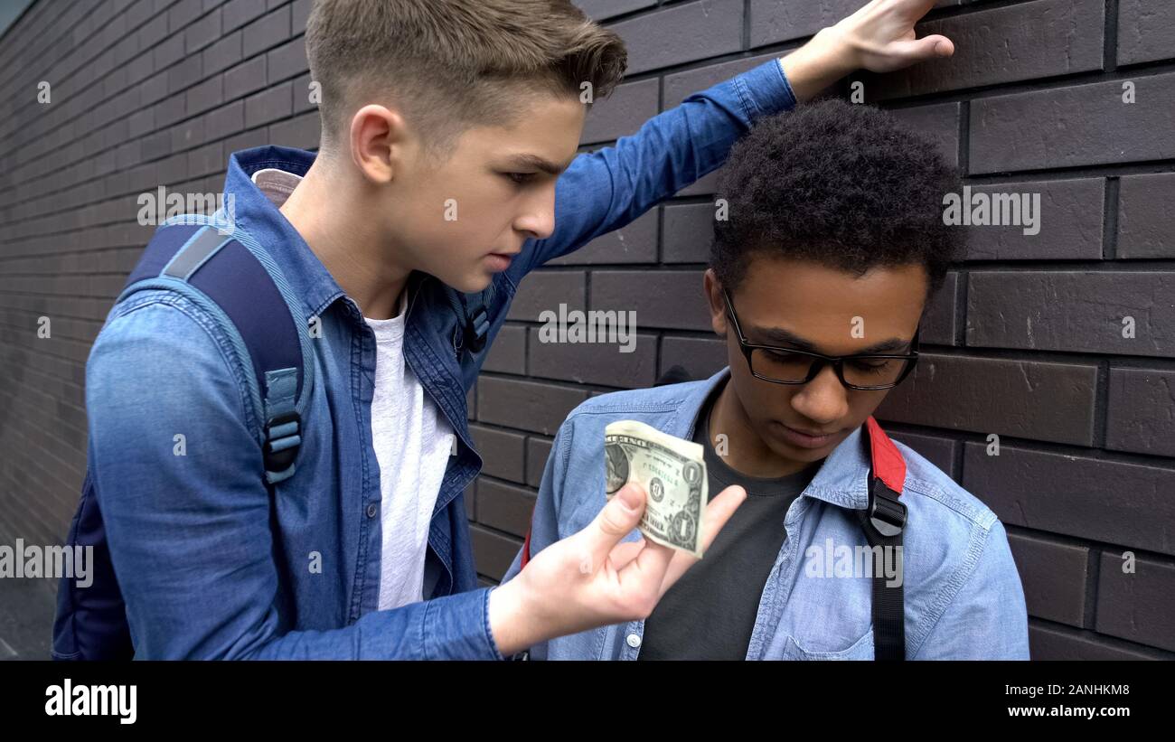 Bully extorting money from poor afro-american boy, dissatisfied with ...