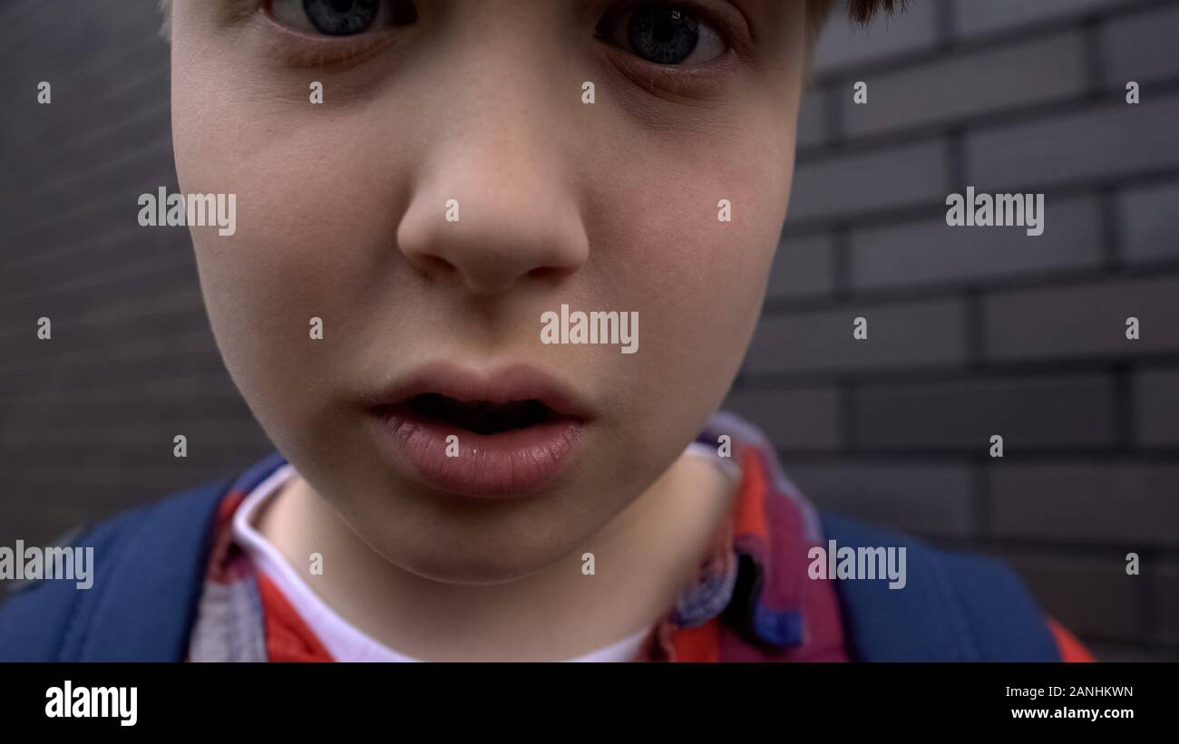 Teenage boy teasing, bullying into camera, provocation to fight, victim ...