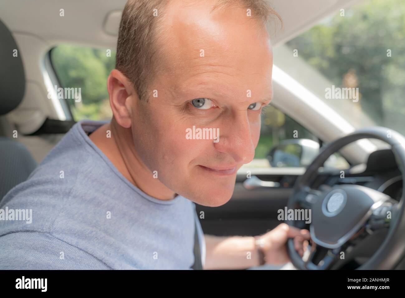 Handsome man looking out the window of the car hi-res stock photography ...
