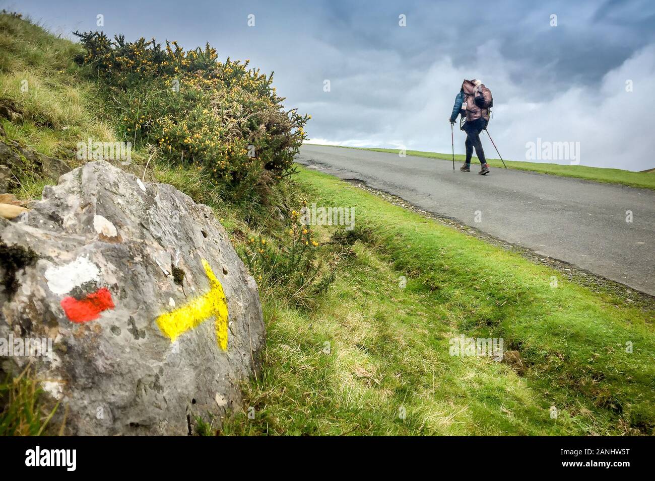 Trail Signs and a Woman Pilgrim Trekking across Pyrenean Mountains ...