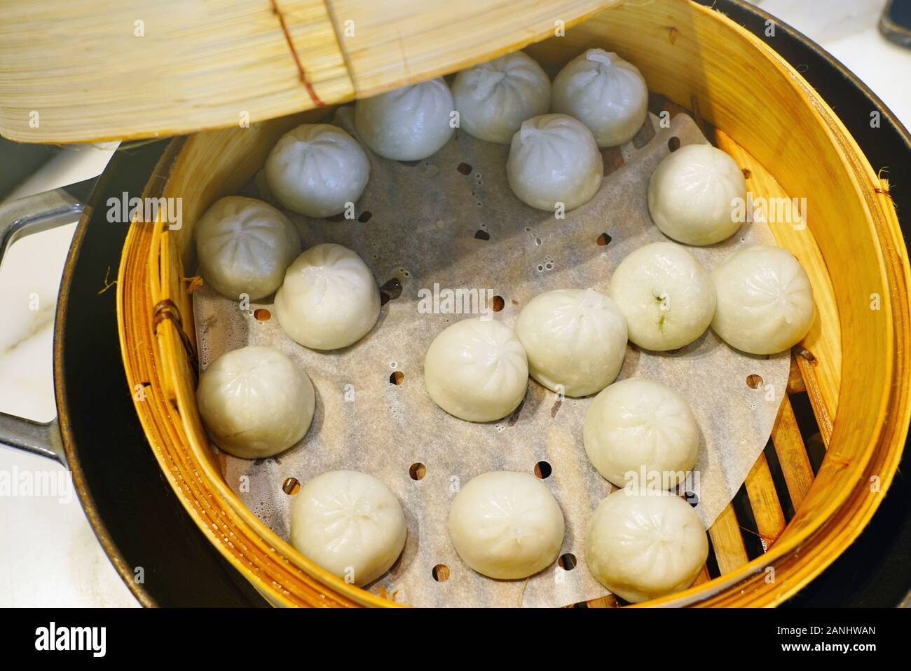 Dim sum dumplings in a steam basket Stock Photo - Alamy
