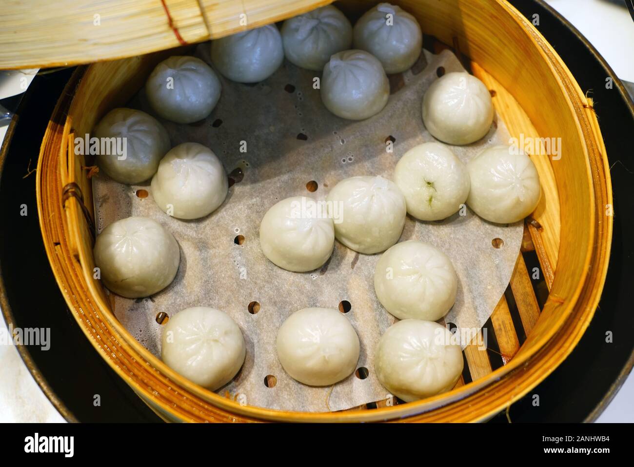 Dim sum dumplings in a steam basket Stock Photo - Alamy