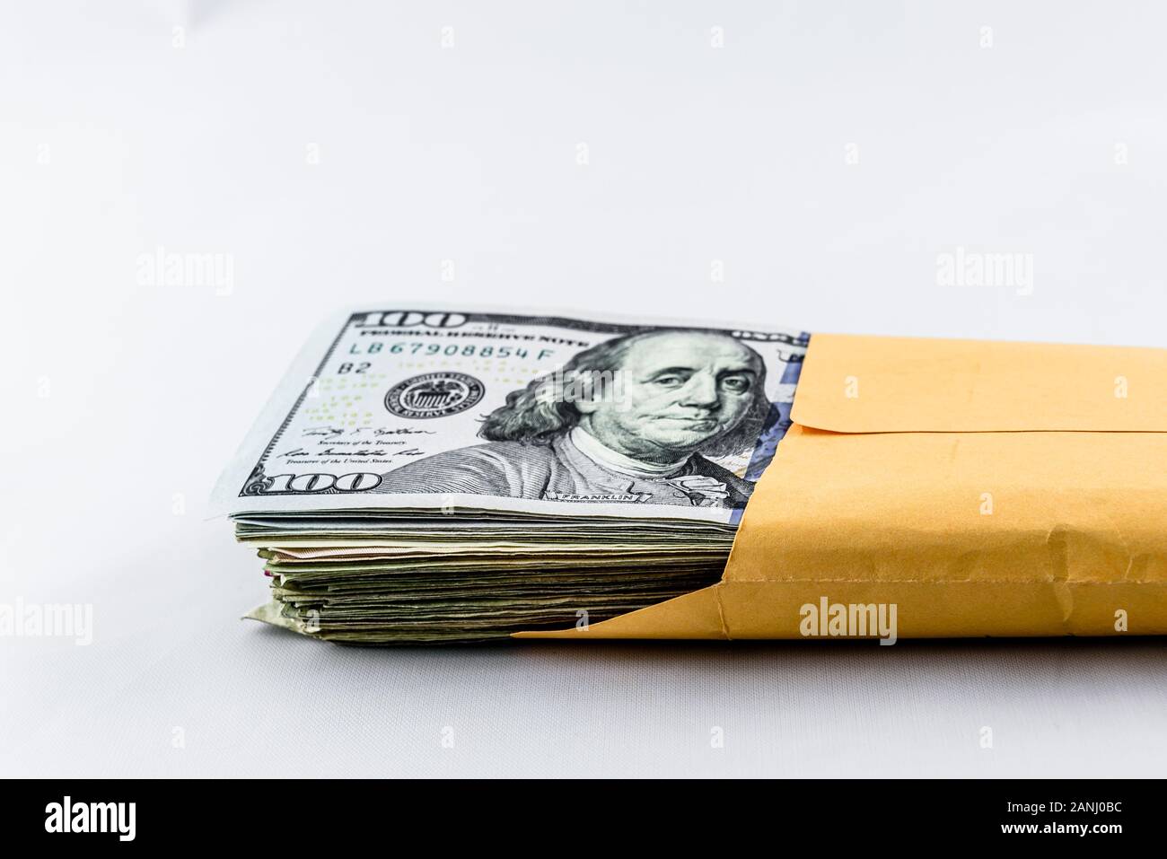 A bank envelope full of $100 bills Stock Photo - Alamy