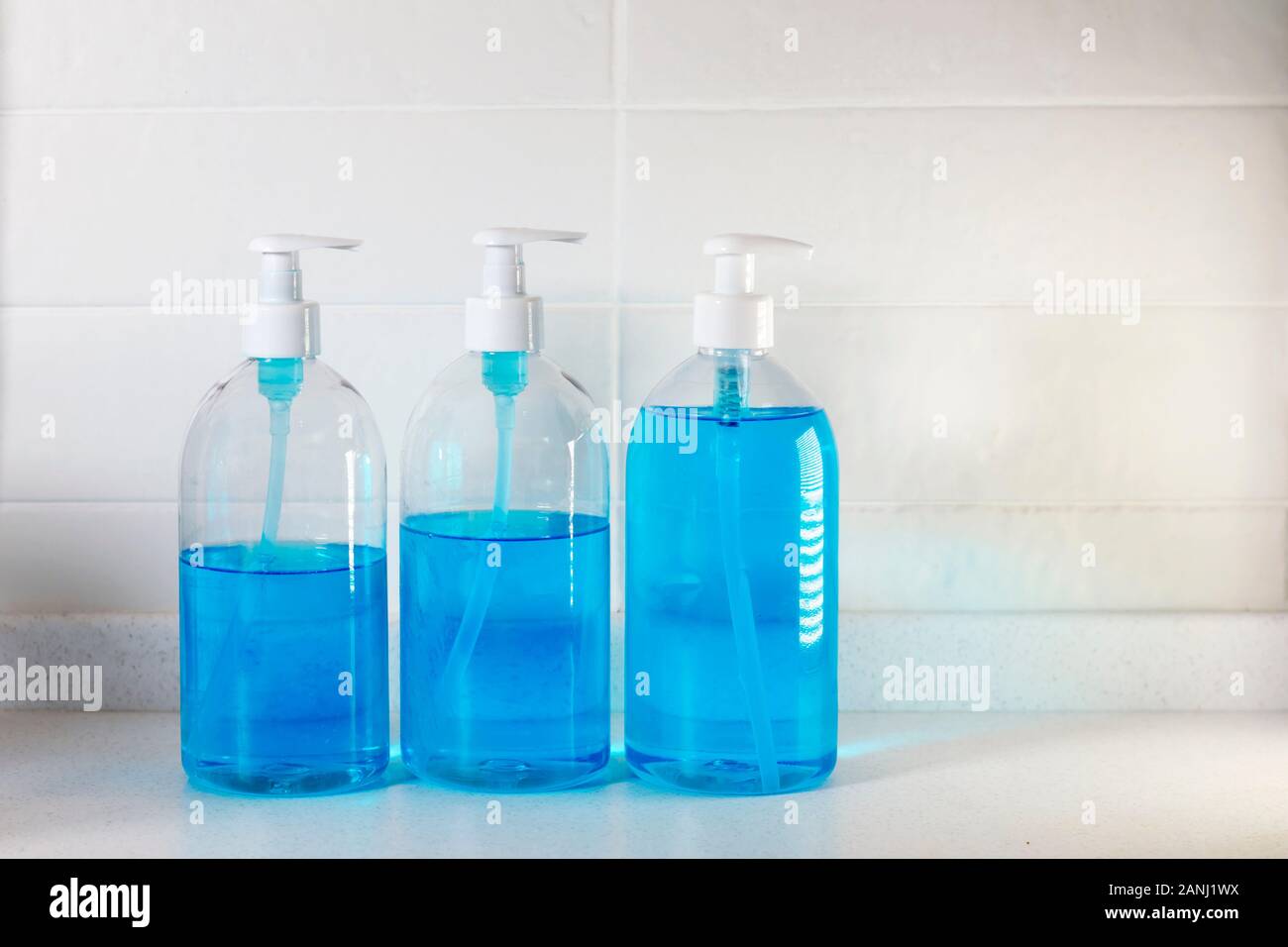 Copy space. Fragment of the interior of the kitchen. Liquid blue soap ...