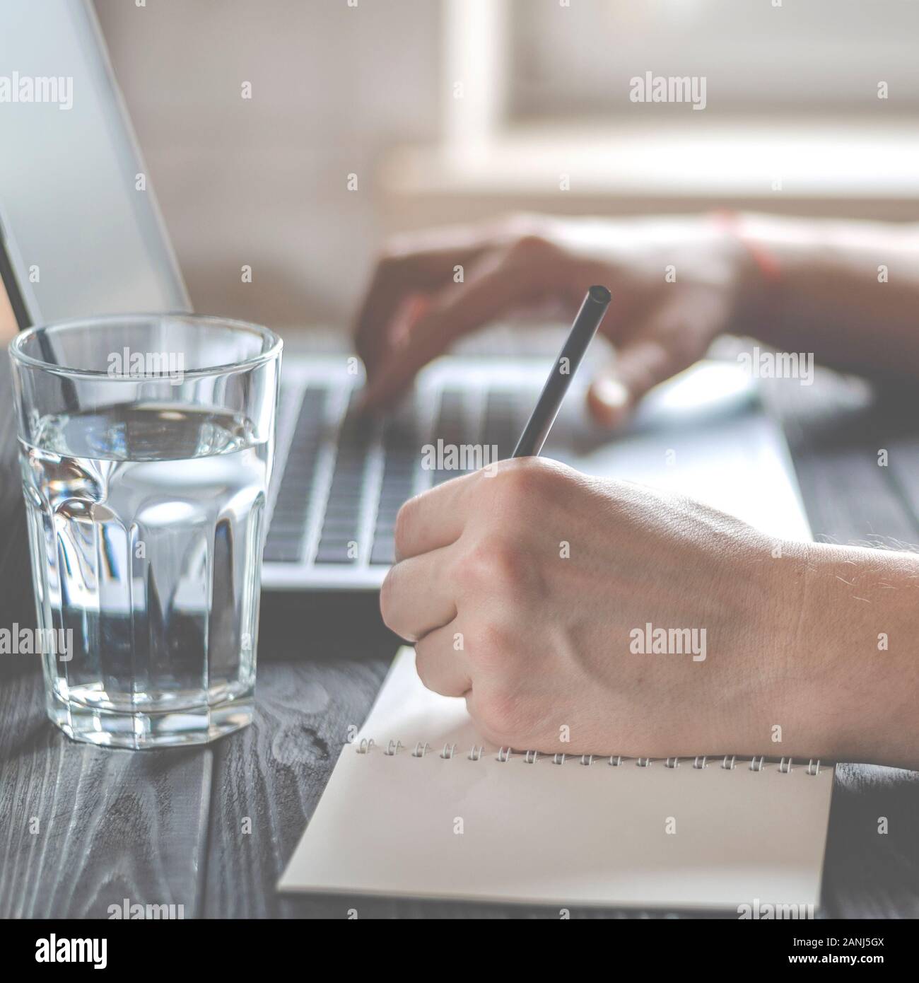 Home office workplace. Man analyzes and checking the graph on laptop ...