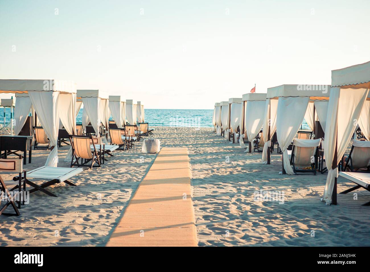 Luxury sun beds on the beach. Beach loungers in famous italian seashore ...
