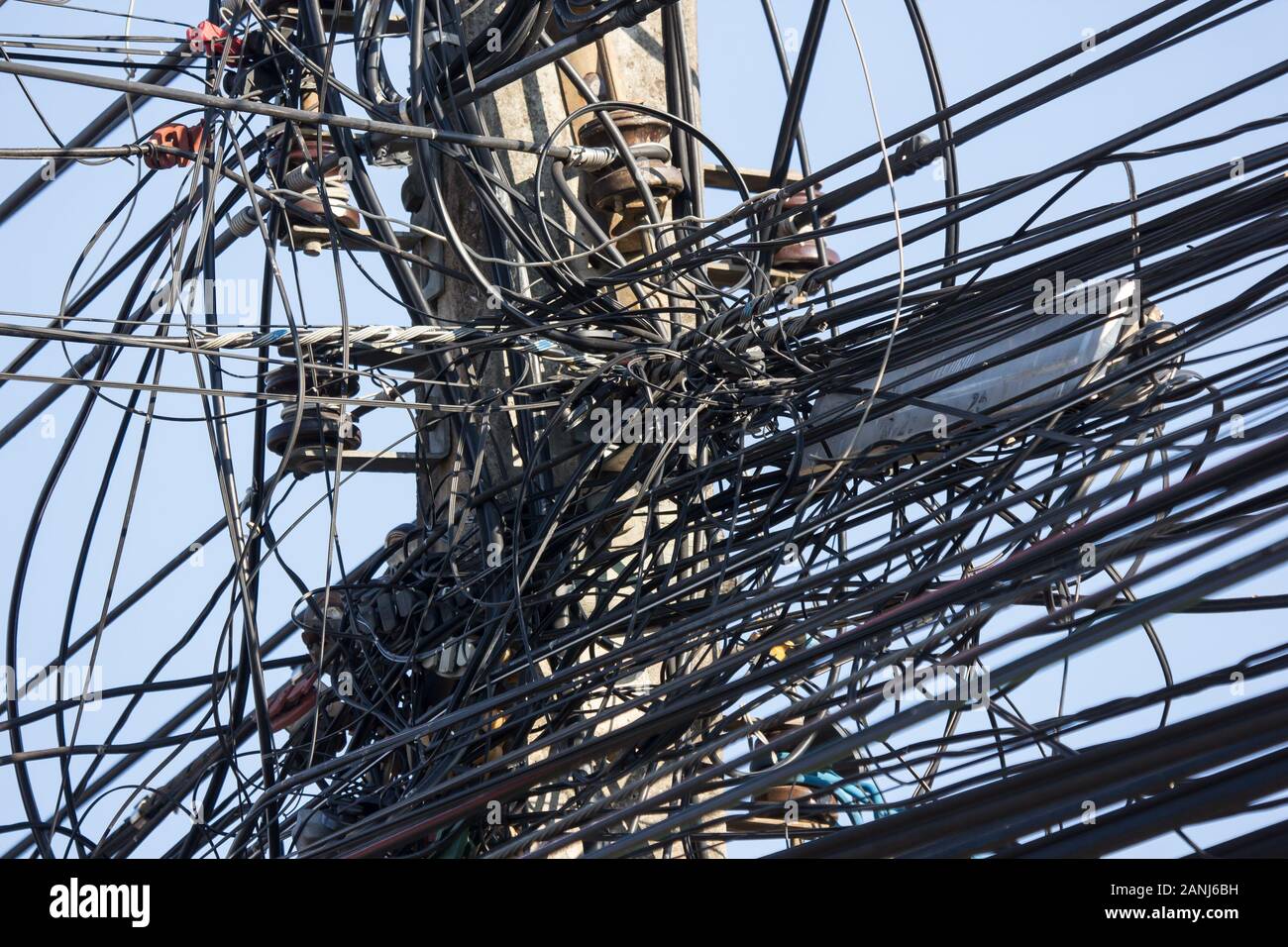 Messy electric wire and cable line Stock Photo - Alamy