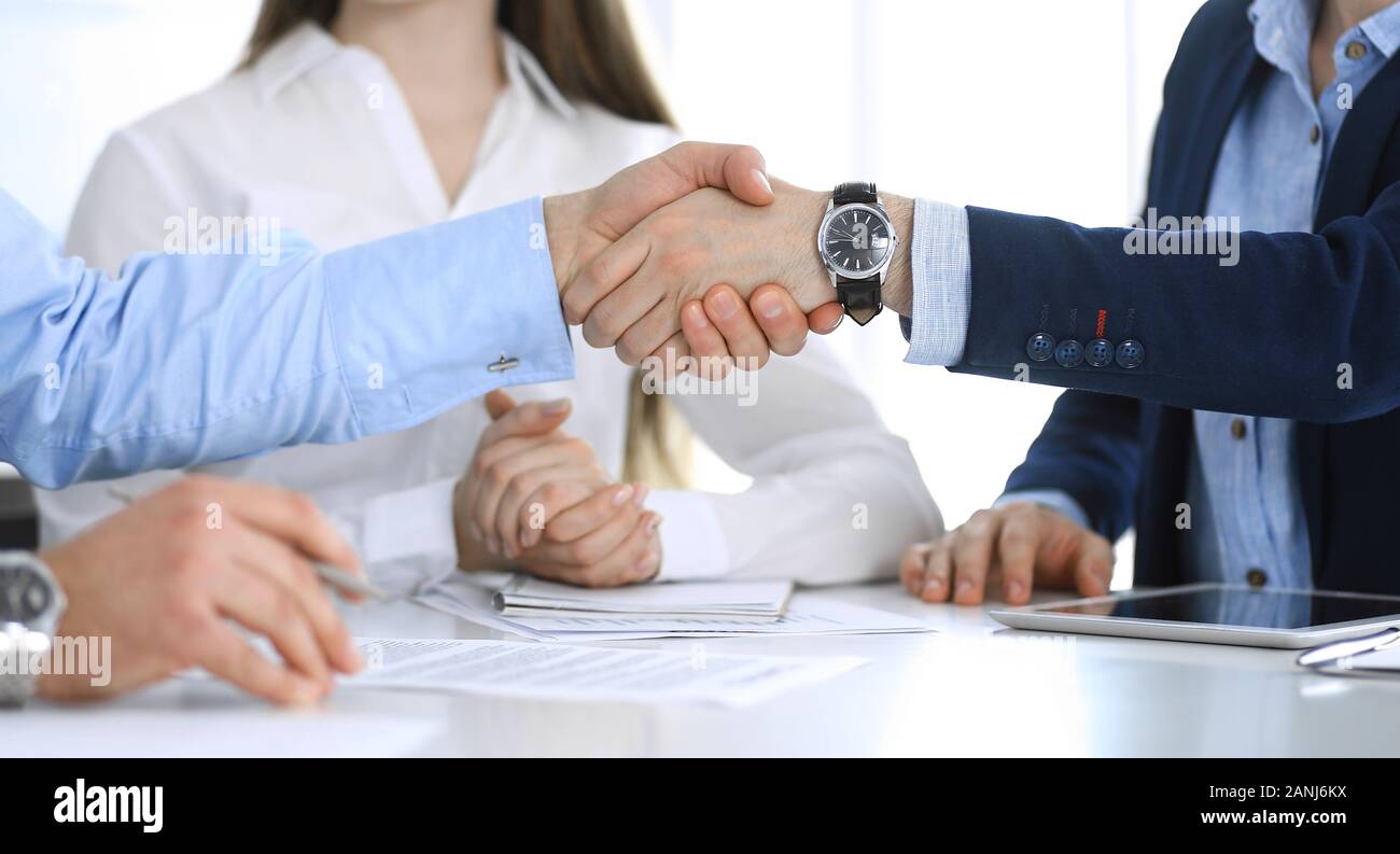 Business people shaking hands at meeting or negotiation, close-up ...