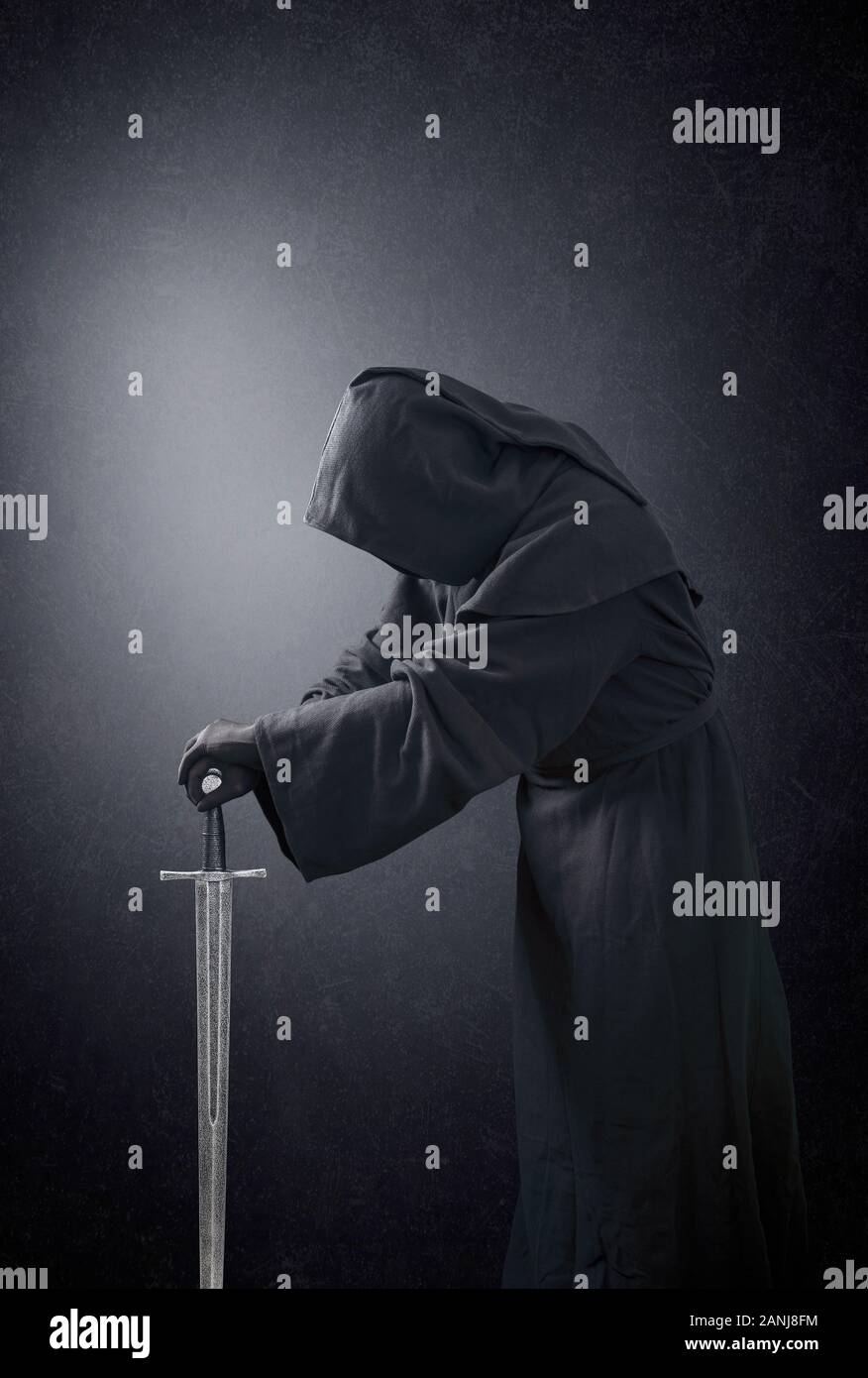 Ghostly figure with long medieval sword in the dark Stock Photo - Alamy
