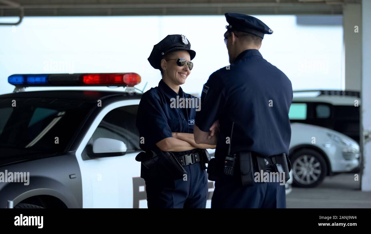 Man and woman cop smiling hi-res stock photography and images - Alamy
