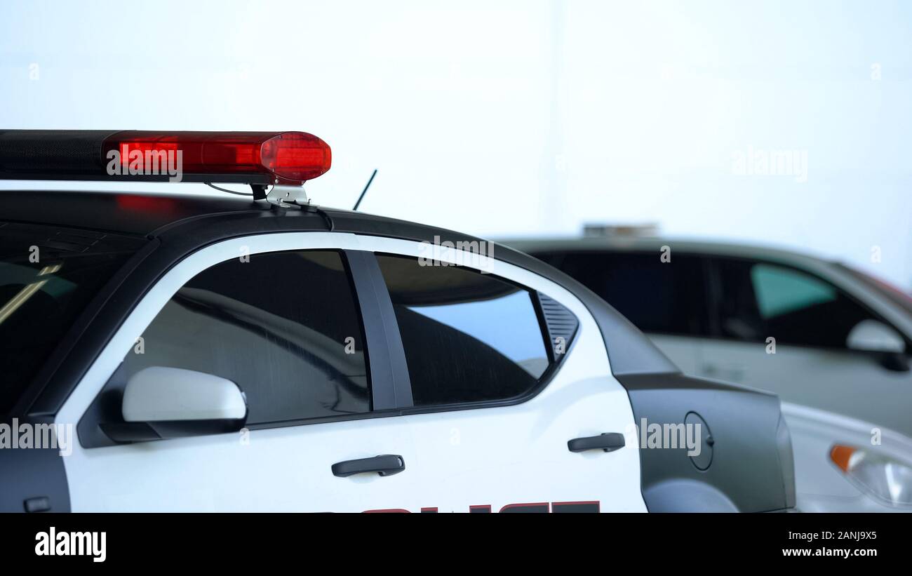 Police car on parking lot, daytime area patrol, maintenance of order ...