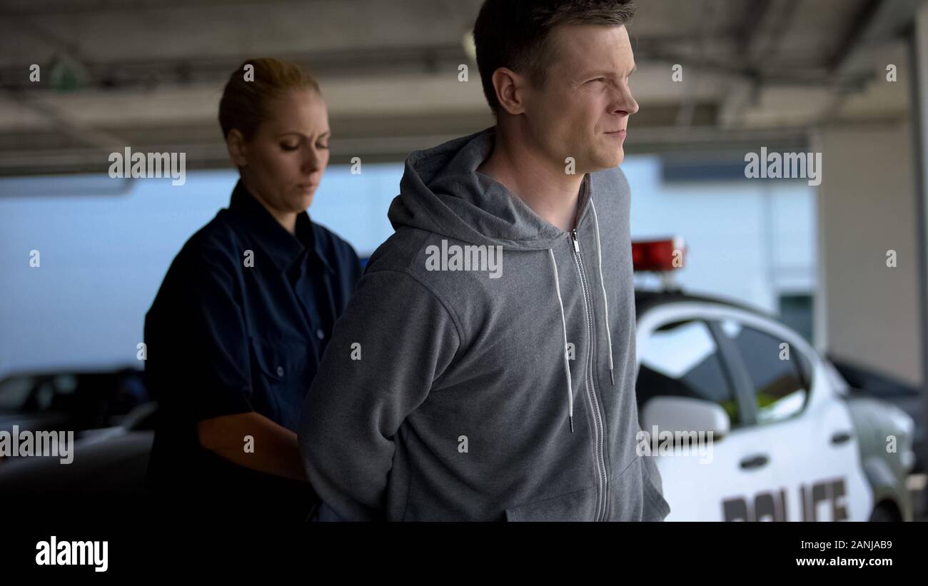 Woman with handcuffs hi-res stock photography and images - Alamy