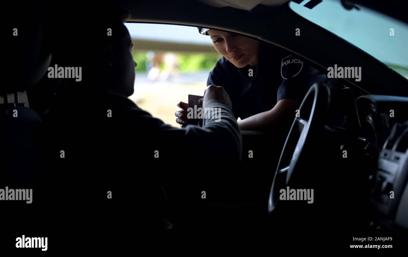 Police officer checking vehicle speed hi-res stock photography and ...