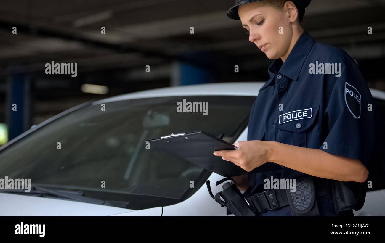 Female Police Writing Ticket