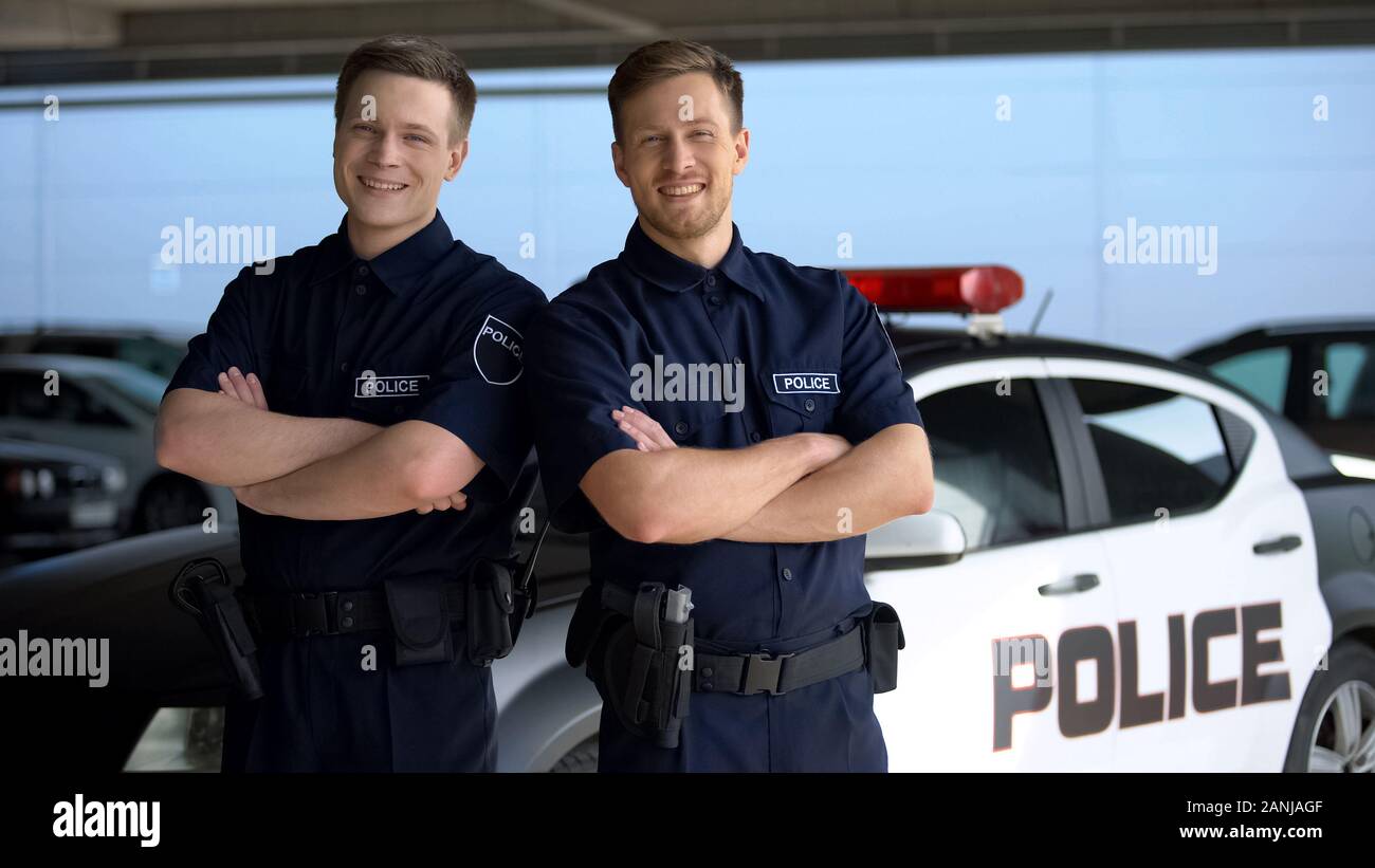 Friendly police officer working hi-res stock photography and images - Alamy