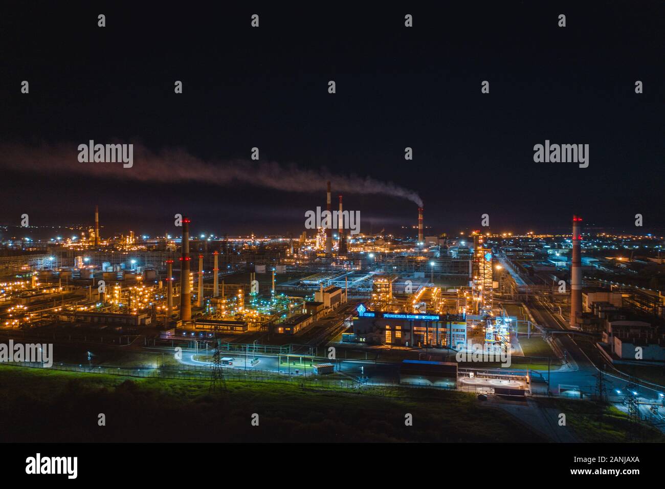 Oil refinery night Stock Photo - Alamy