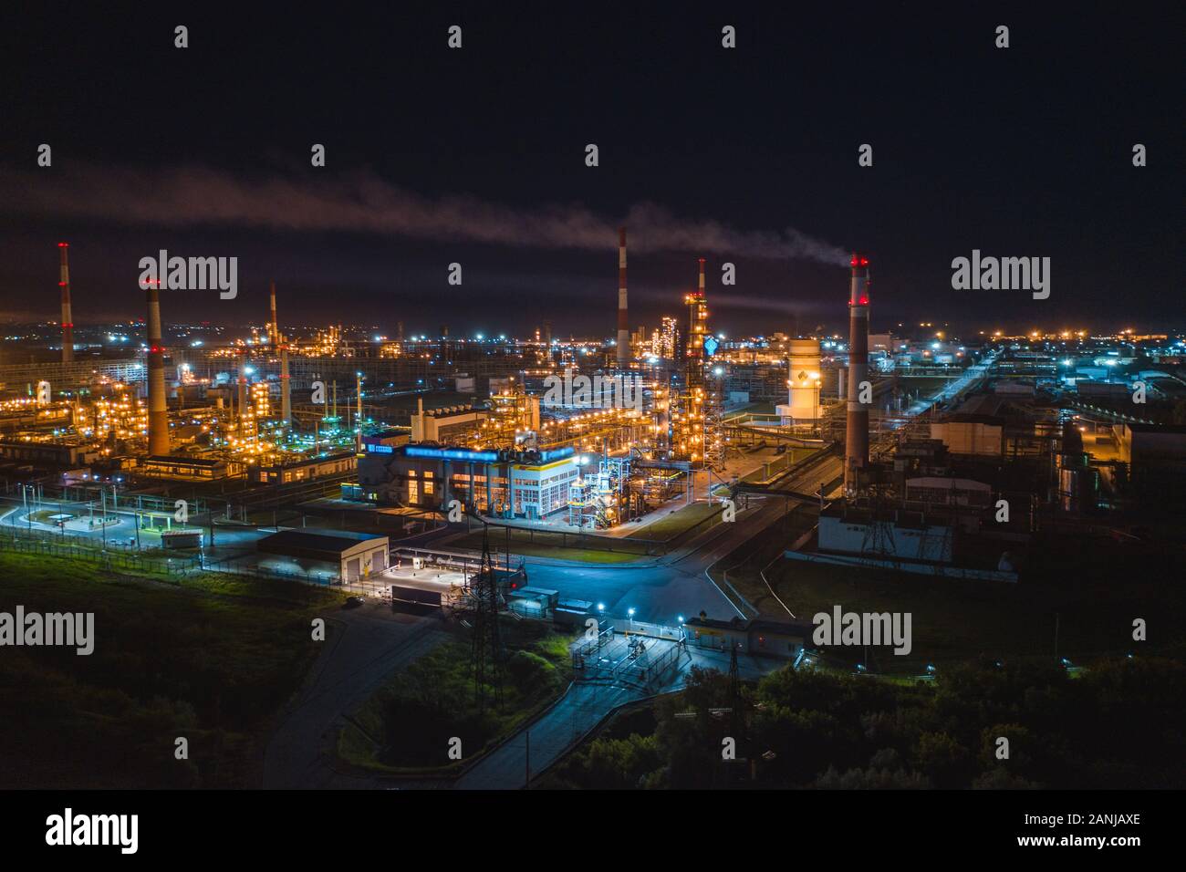 Oil refinery night Stock Photo - Alamy
