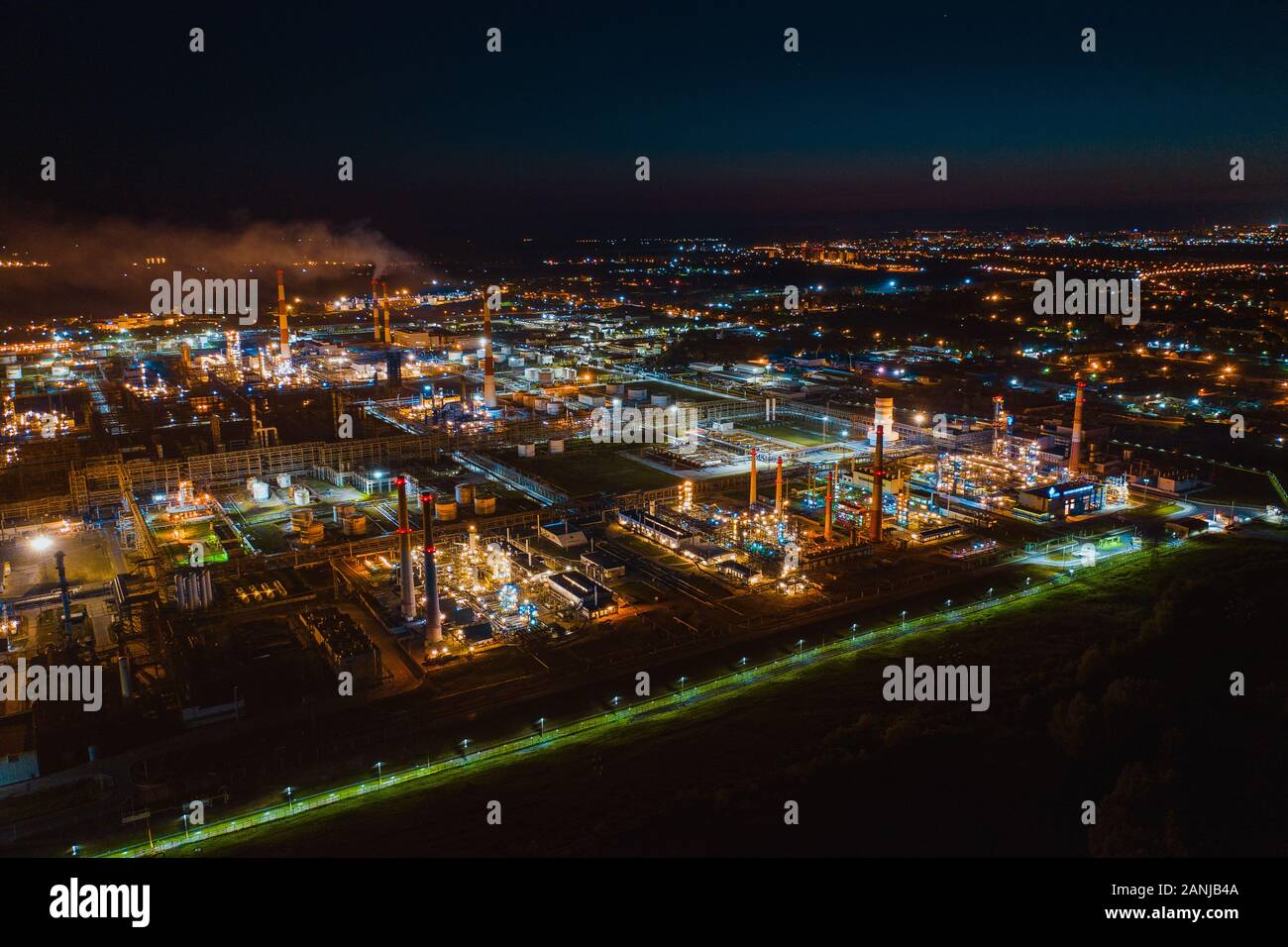 Oil refinery night Stock Photo - Alamy