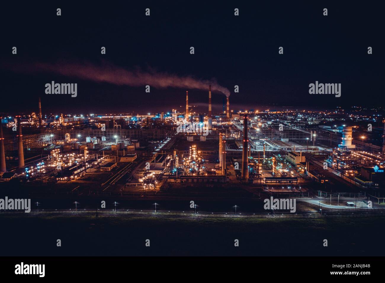Oil refinery night Stock Photo - Alamy