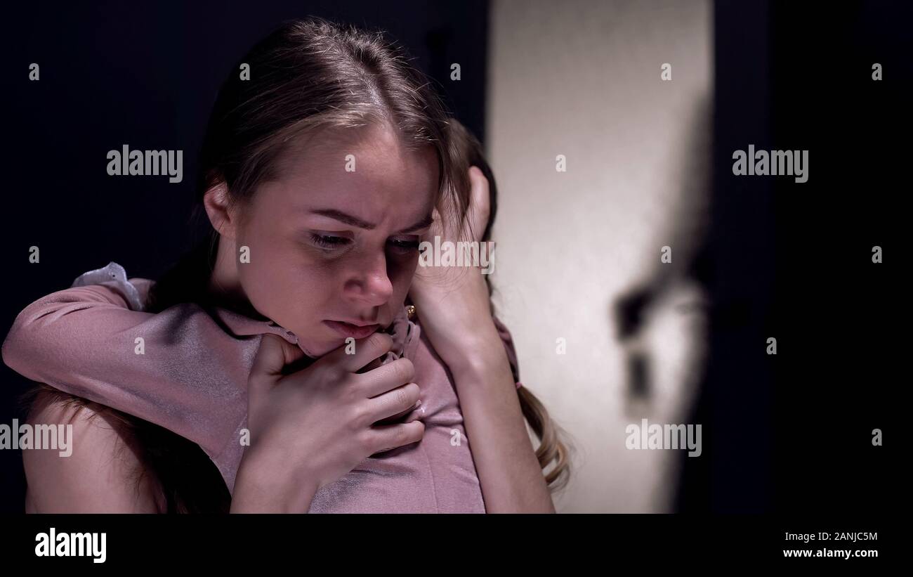 Defenseless woman hugging child, drunkard male with bottle entering ...