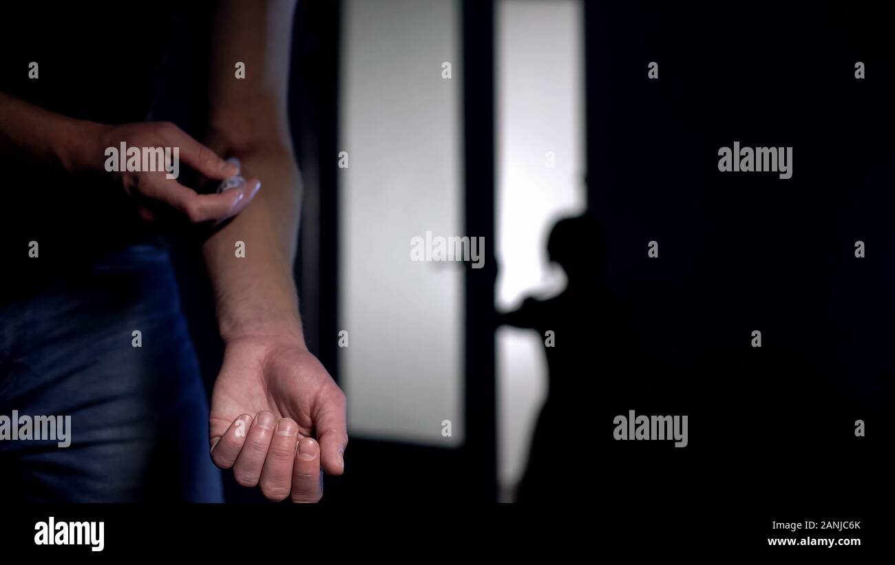 Little girl silhouette watching addict dad making drug injection ...